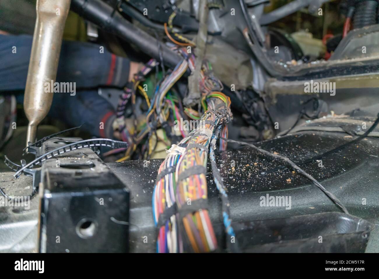 Mechanic electrician checking repairing upgrading wiring. Auto service ...