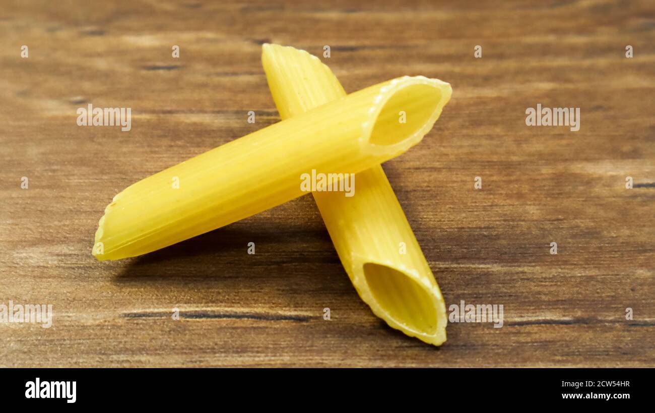 Penne Rigate Raw Pasta is a short pasta with oblique cuts and a ribbed ...