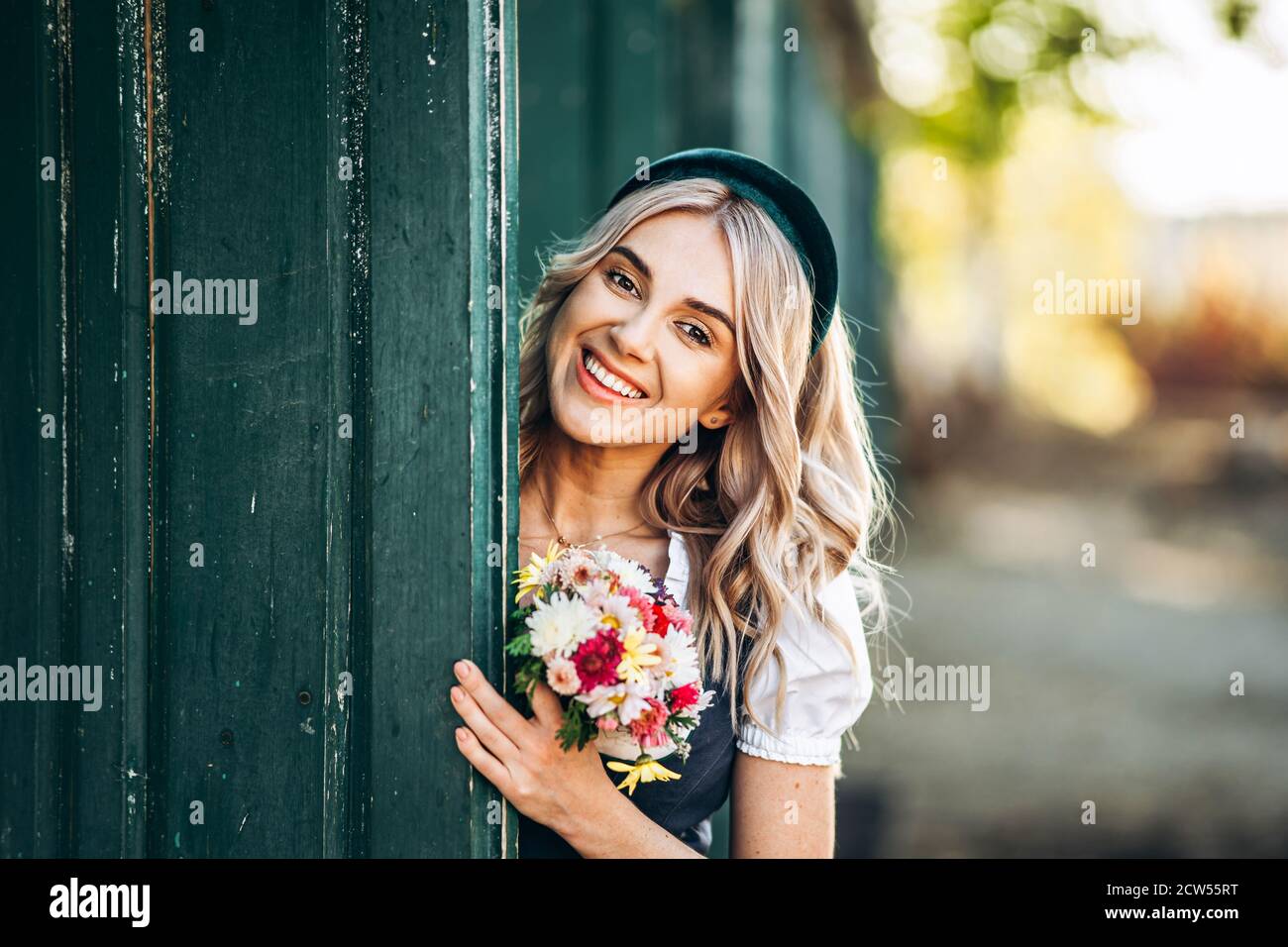 Pretty blonde in dirndl, traditional oktoberfest dress and headband ...
