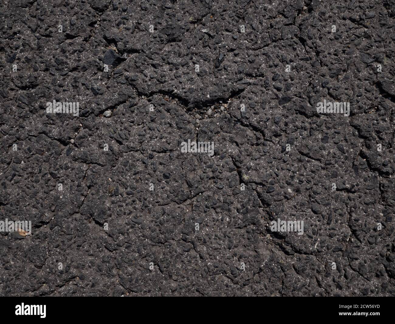 Cracked and damaged old asphalt road detail. Pattern of asphalt road ...