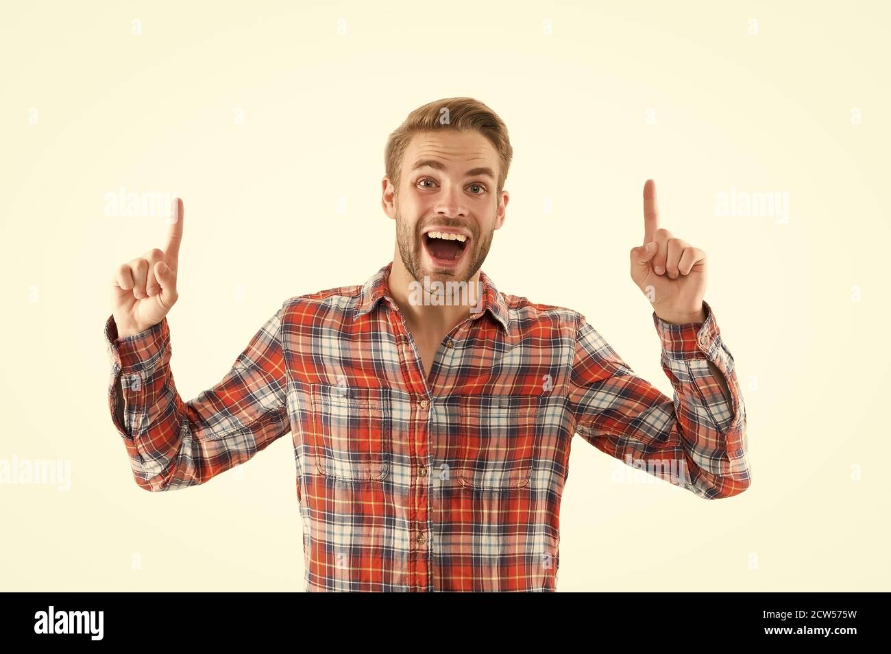 Check it out. Look there. Man pointing at copy space. Man muscular ...