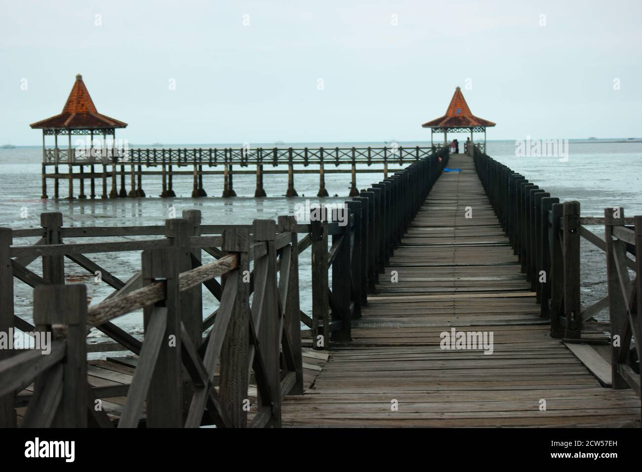 Wooden pier in Bentar Beach in Indonesia during daylight Stock Photo ...
