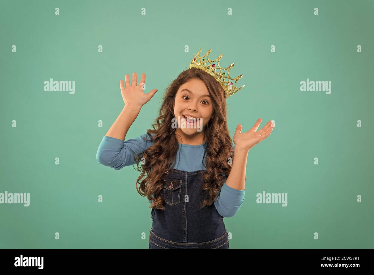 Expert of fun. Kid wear golden crown symbol of princess. Girl cute baby ...