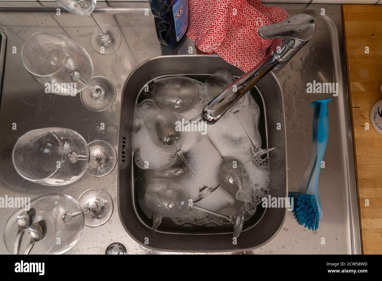 kitchen after a larger dinner, cooking party, sink with dirty glasses ...