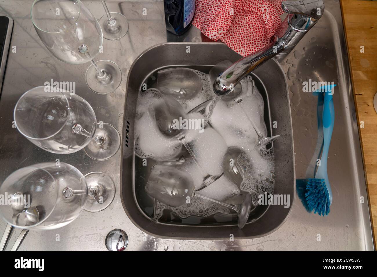 kitchen after a larger dinner, cooking party, sink with dirty glasses ...