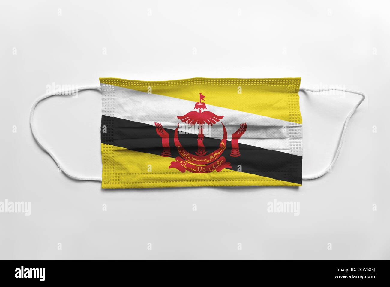 Face mask with Brunei flag printed, on white background, isolated Stock ...