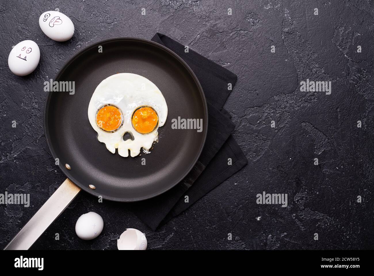 Fried eggs in the shape of a skull. Halloween breakfast Stock Photo - Alamy