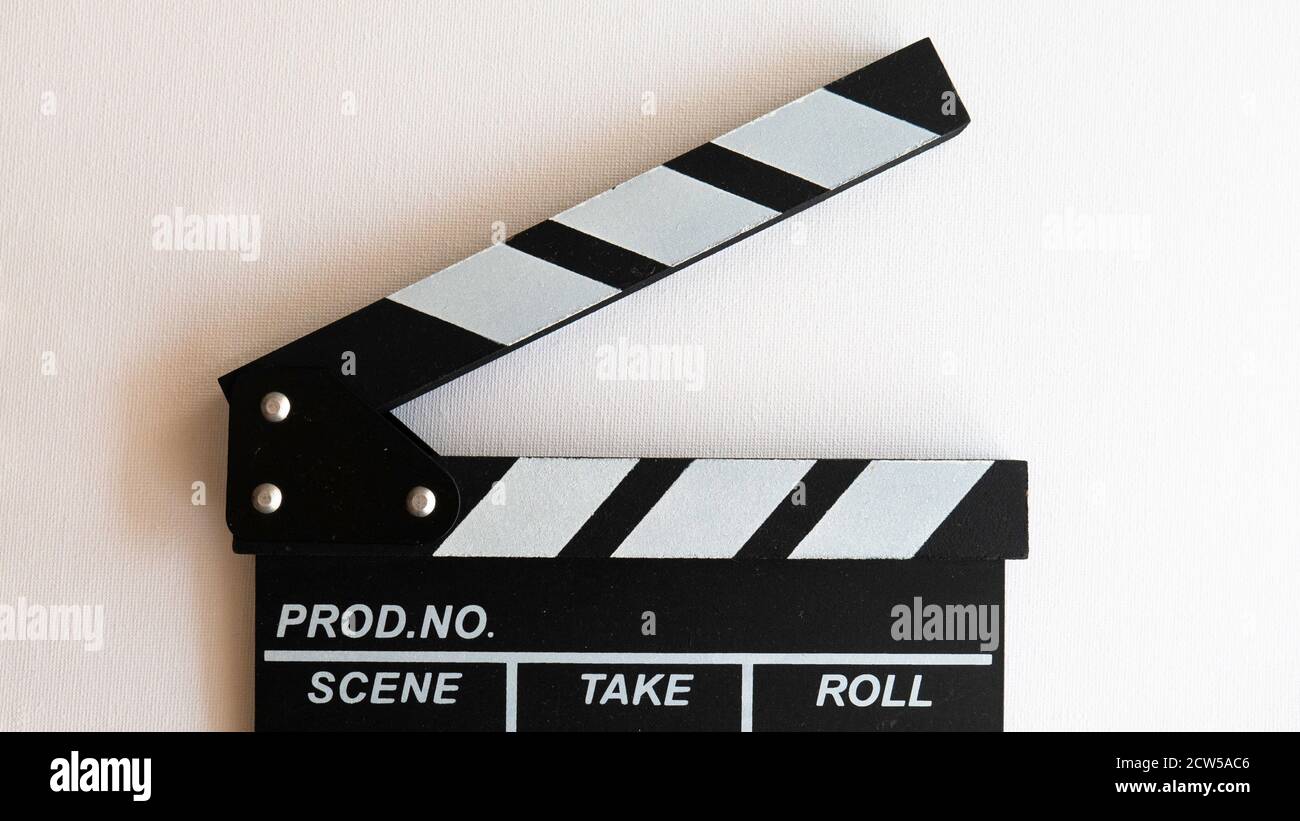 Close up of a wooden black clapperboard isolated on white background ...