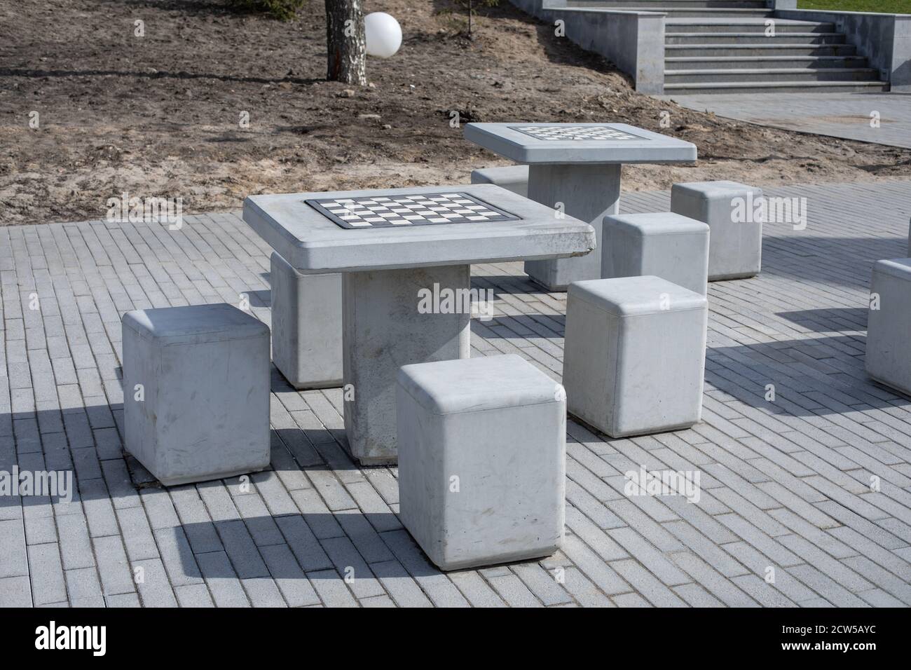 Chess table and chairs in gray concrete for playing chess, city ...