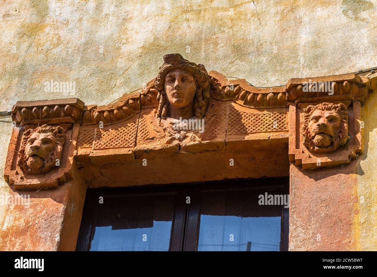 Sculpture on the window Stock Photo - Alamy