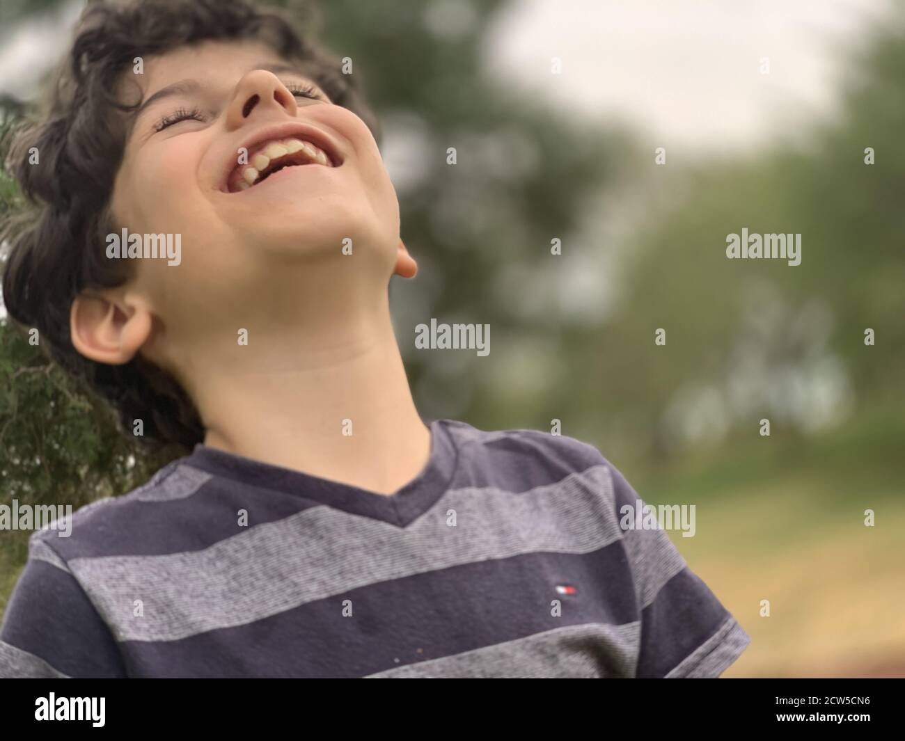 Cheerful Asian child laughing Stock Photo - Alamy
