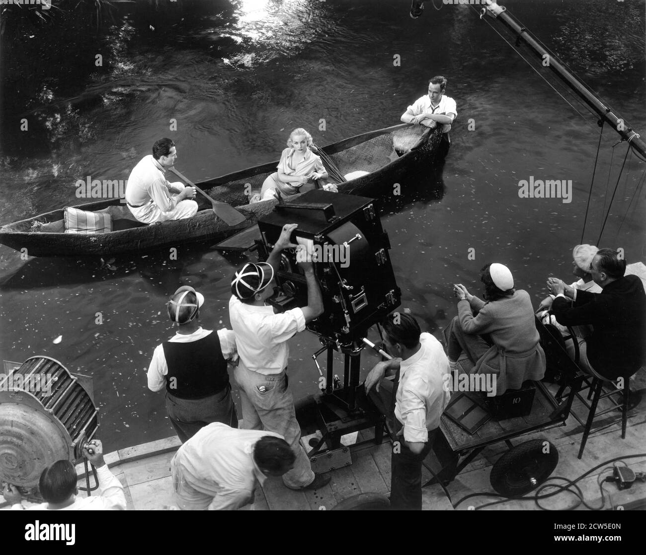 KENT TAYLOR and CAROLE LOMBARD in Canoe with Movie Crew on set candid ...