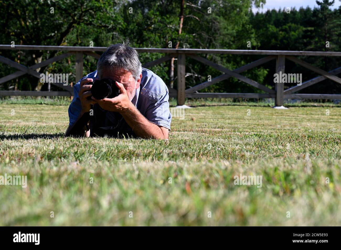 Man shooting with a camera Stock Photo - Alamy
