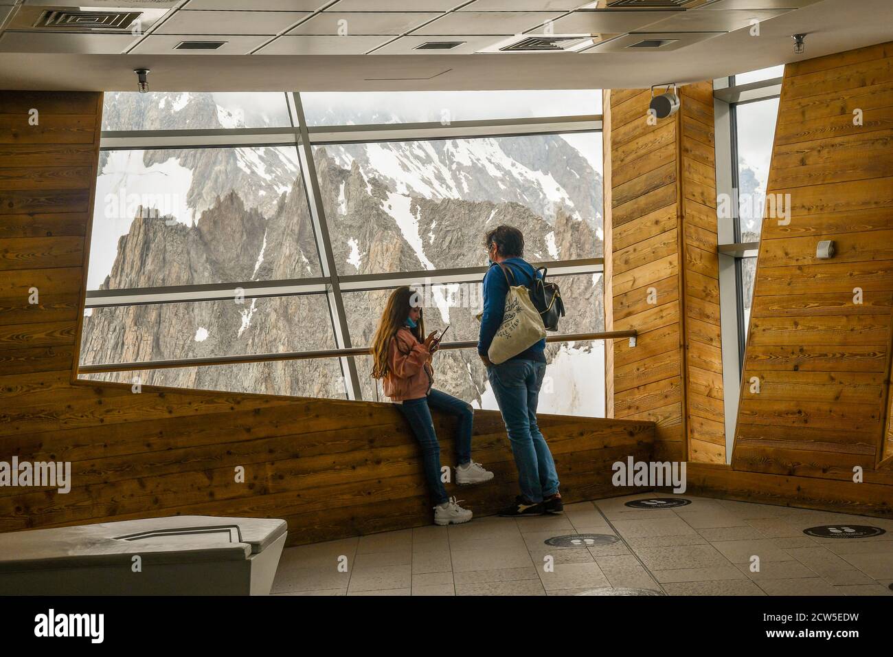 Father and daughter inside Pointe Helbronner station of Skyway Monte ...