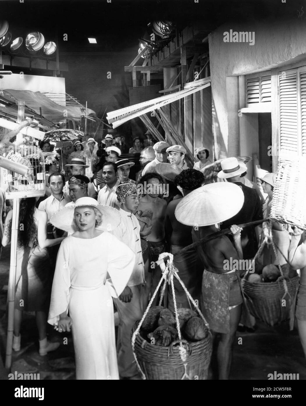 CAROLE LOMBARD on set candid with Extras filming on Malaysian Street ...