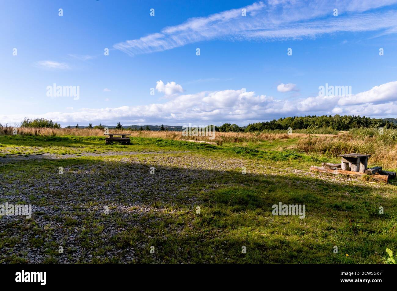 A wide open field offering scenic country views towards a distant ...