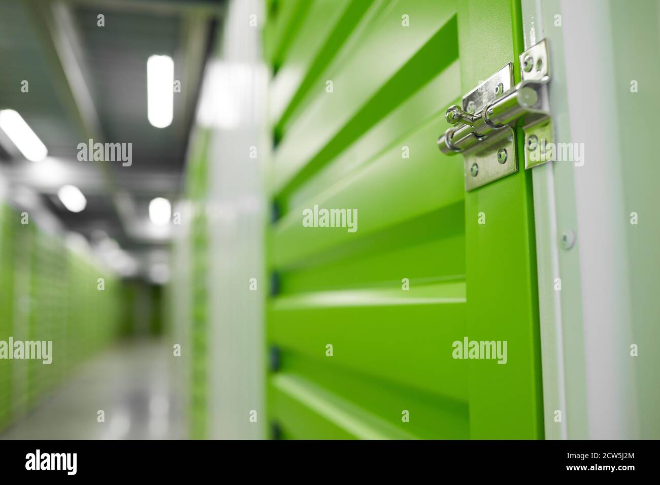 Close up background image of storage facility with focus on lock latch ...
