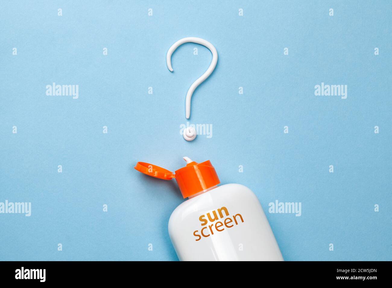 Sunscreen. Cream in the form of question mark on blue background with ...