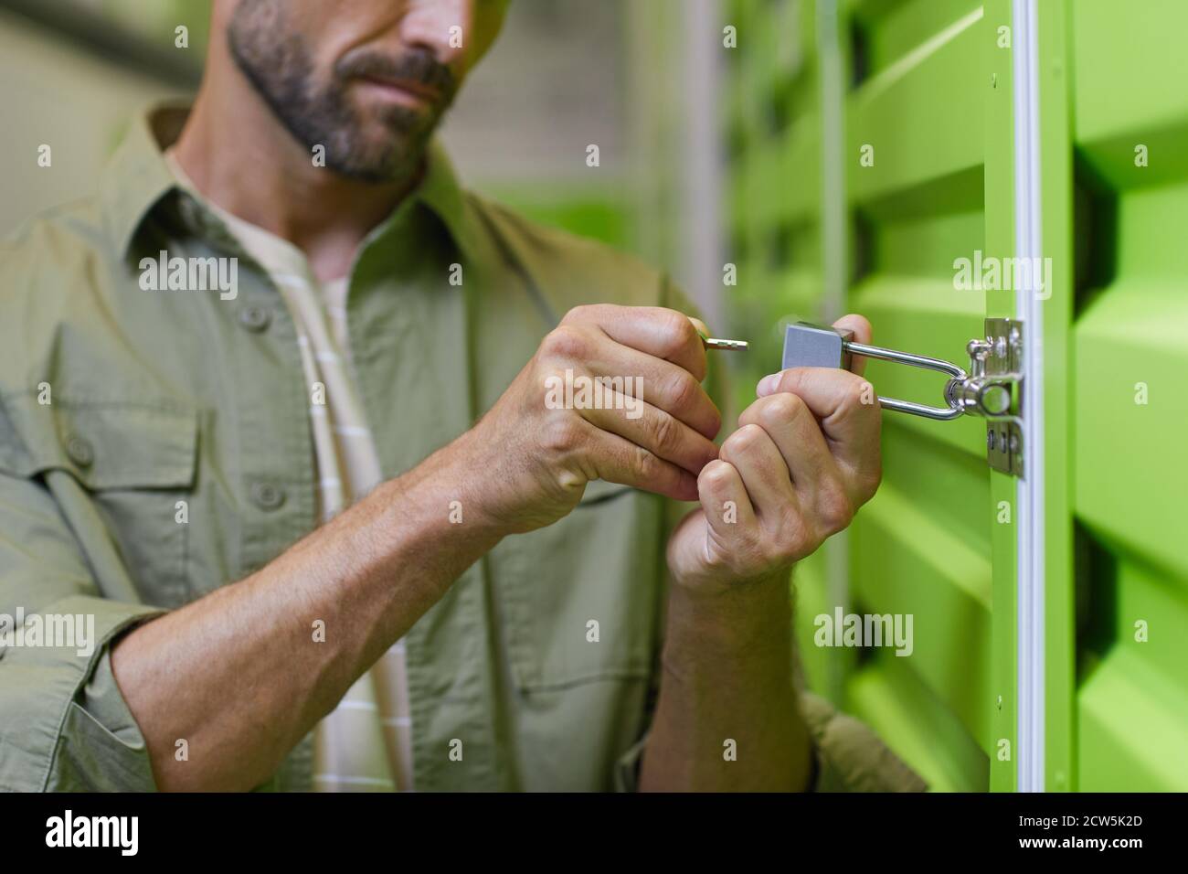 Man opening lock hi-res stock photography and images - Alamy