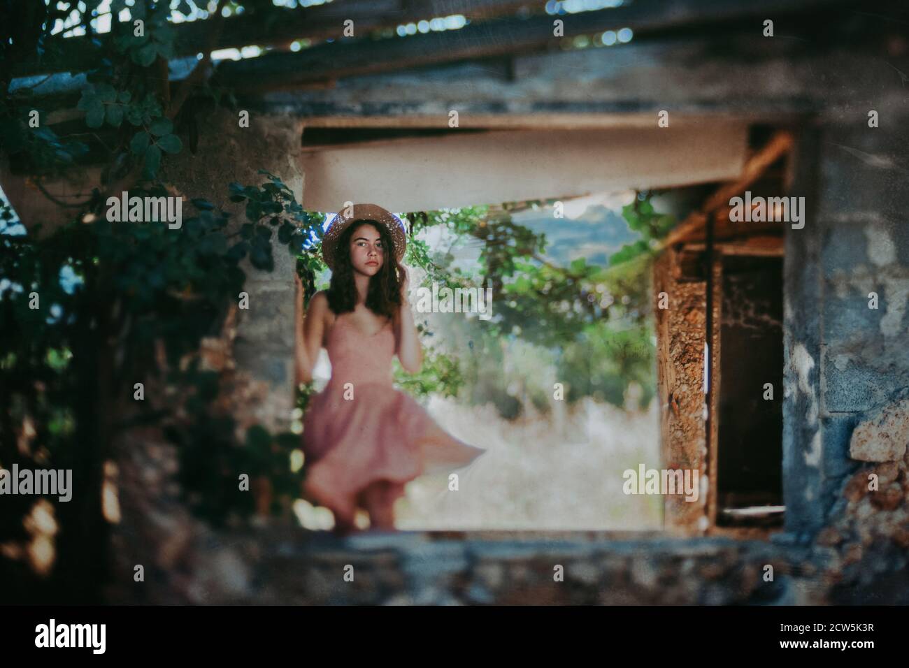 Girl in tumbled down cottage Stock Photo - Alamy