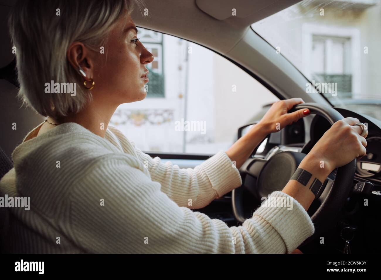 Woman car driving lisbon hi-res stock photography and images - Alamy