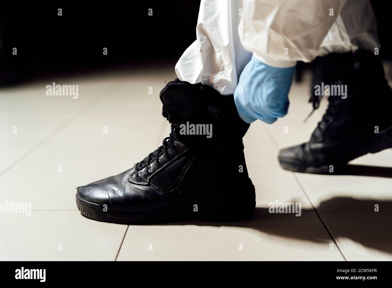 military putting on protective boots Stock Photo - Alamy military putting on protective boots Stock Photo - Alamy