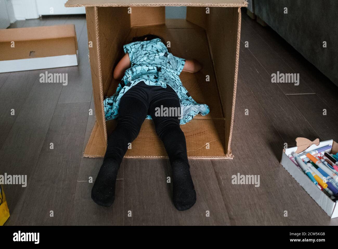 Little girl sleeping in large cardboard box Stock Photo - Alamy