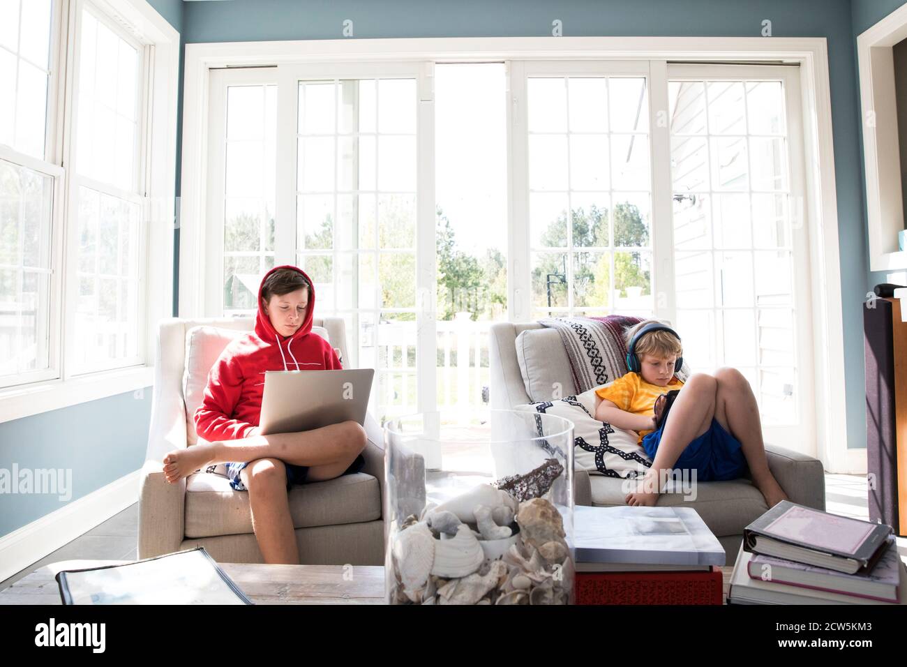 Grade School and Tween Brothers Do Virtual Learning Together Stock ...