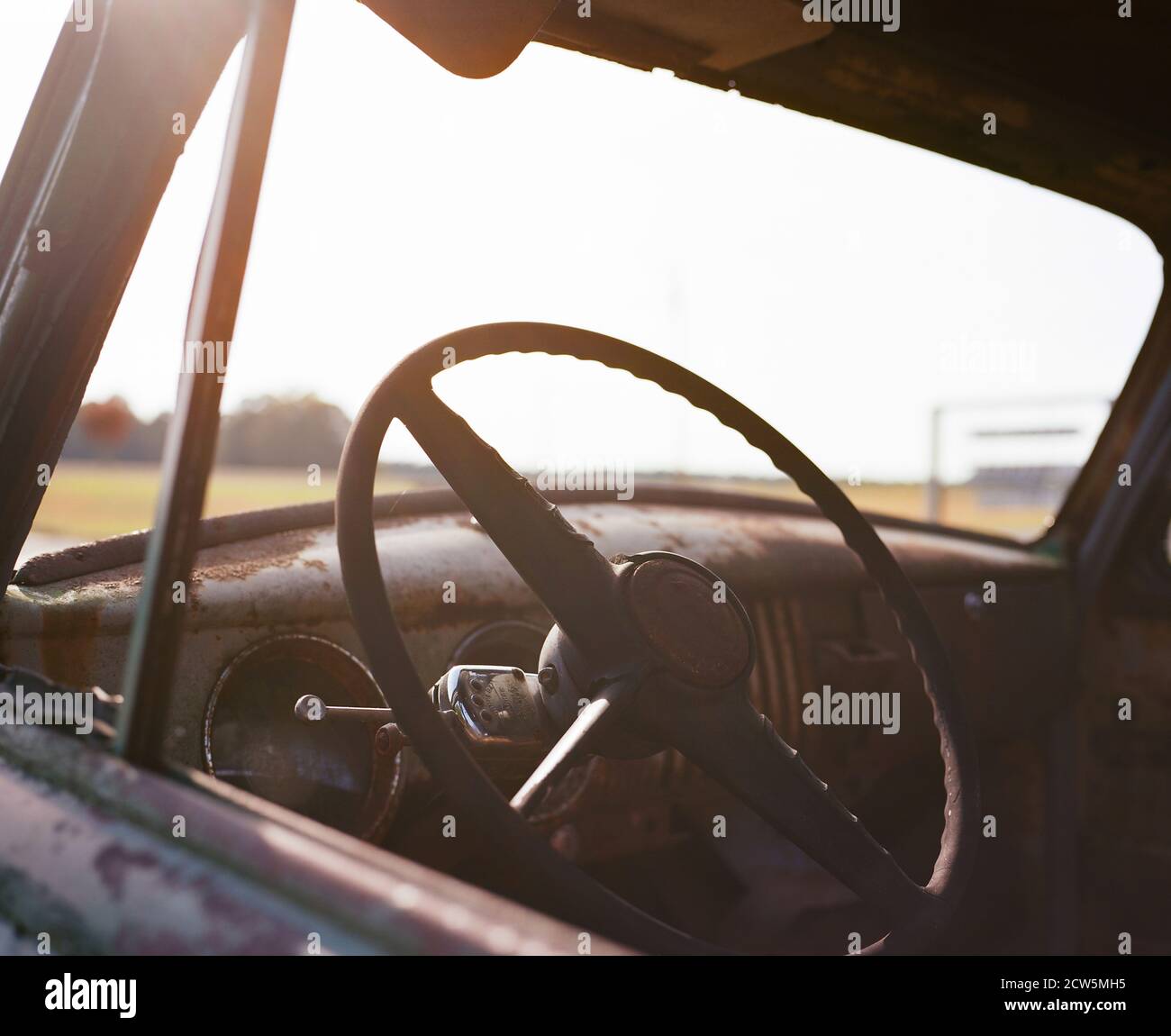 Steering wheel in rusted old junkyard truck Stock Photo - Alamy