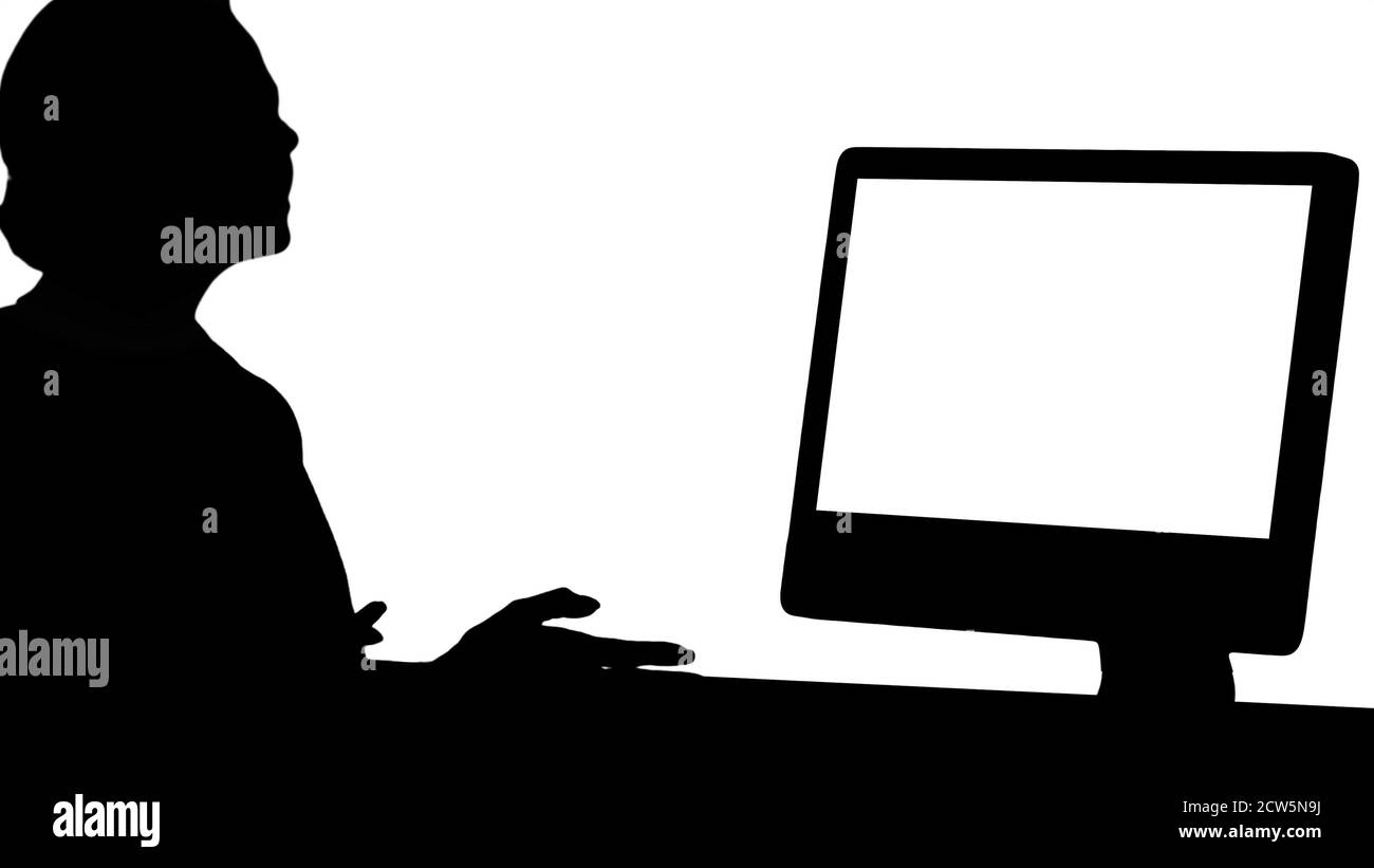 Silhouette Video chat with someone by young woman Stock Photo - Alamy