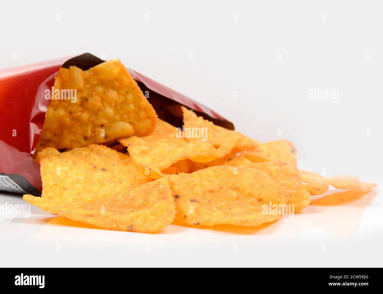 Open bag of crisps a ultra processed food Stock Photo - Alamy