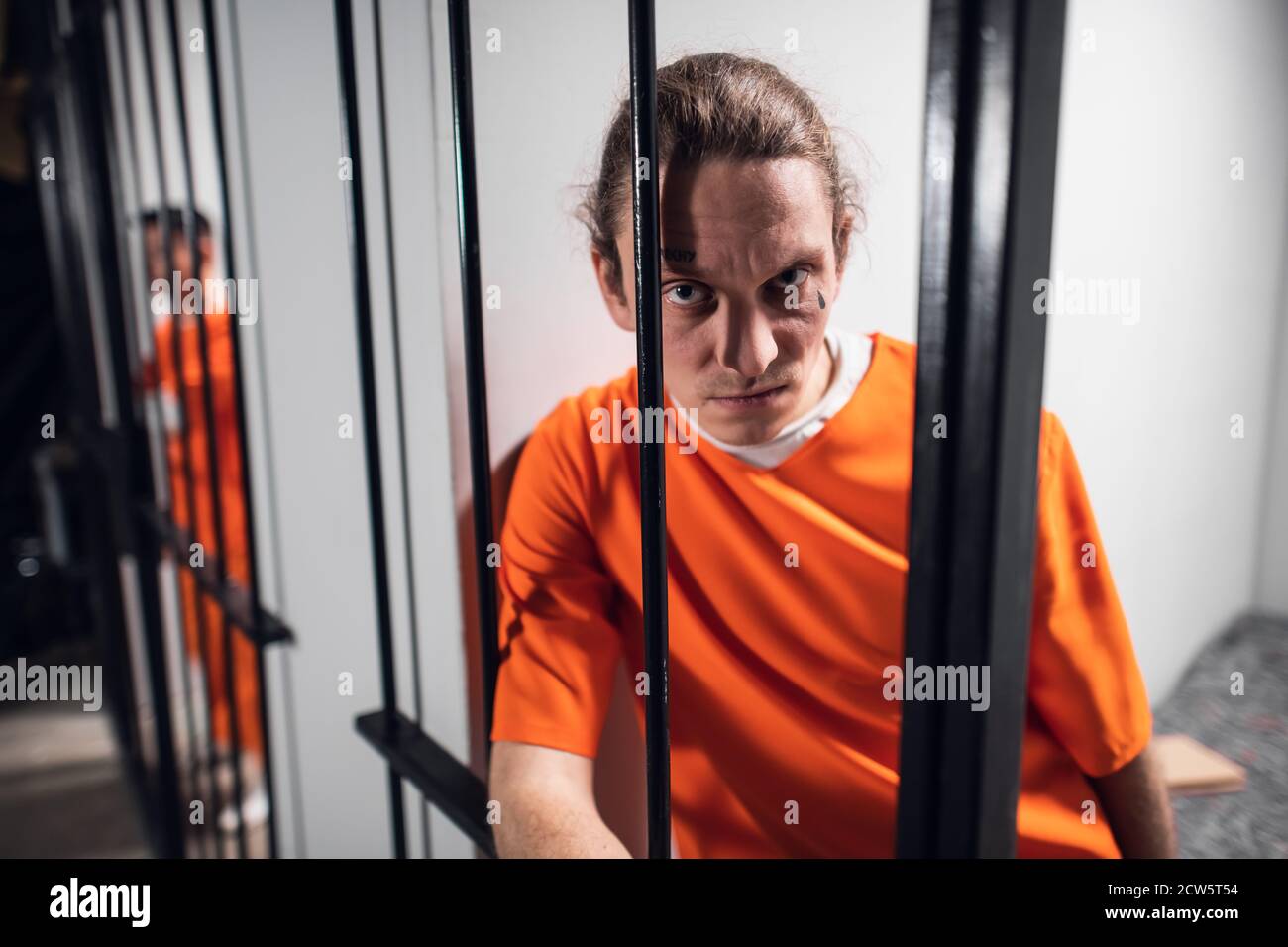 Male portrait jail bars and hands hi-res stock photography and images ...