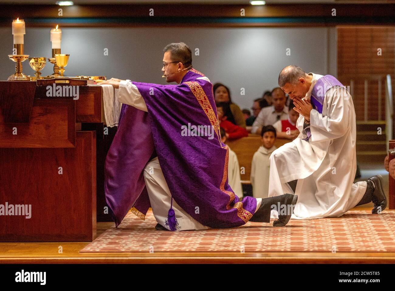 Priest Praying On Knees