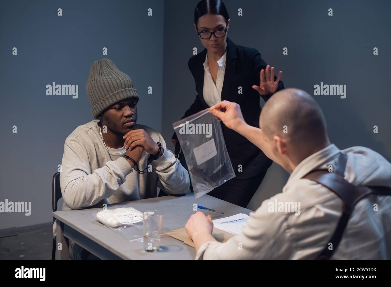 An experienced investigator during the interrogation shows the alleged ...