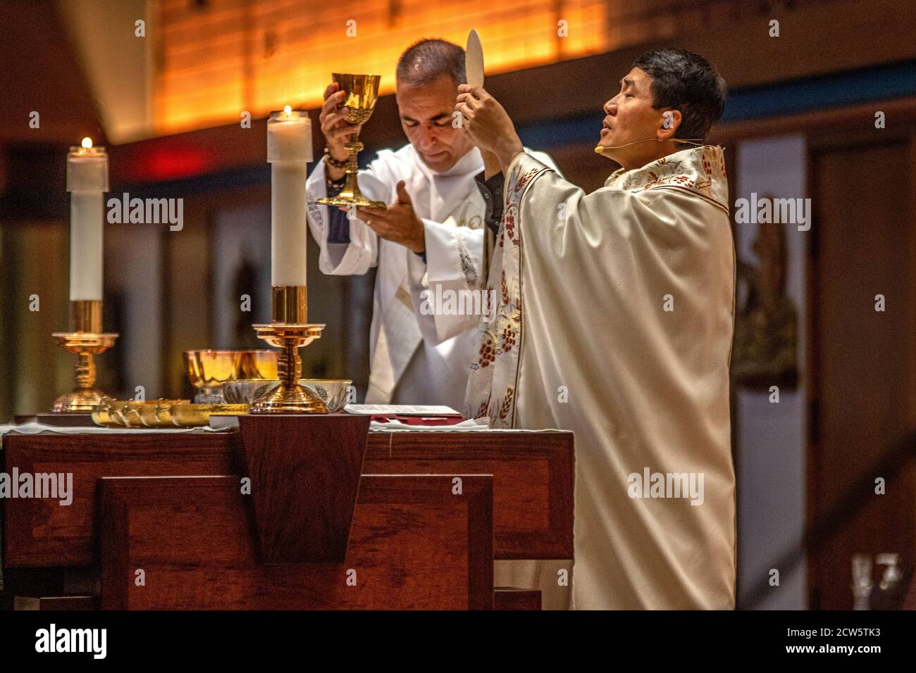 Priest conducting mass hi-res stock photography and images - Alamy
