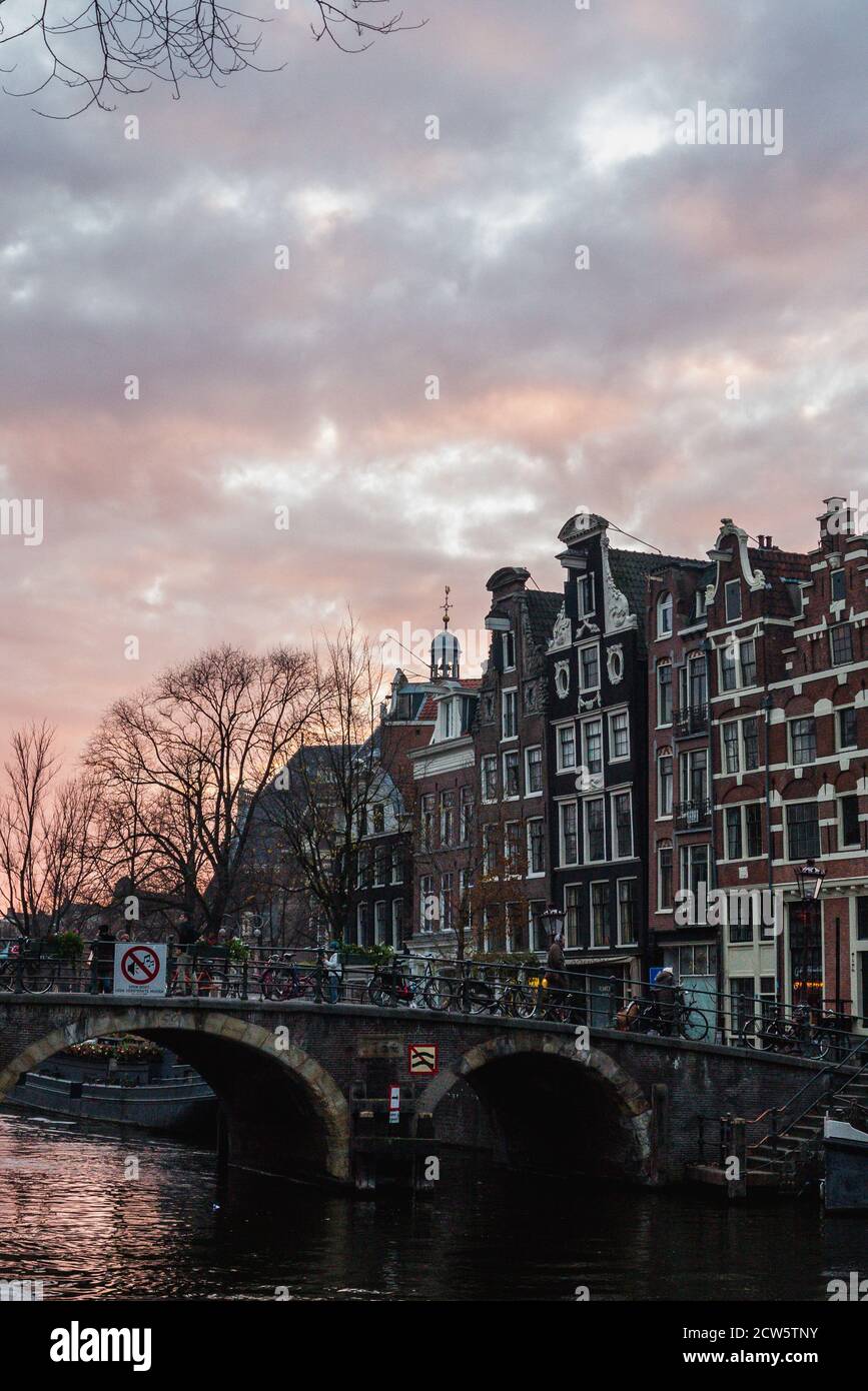 A sunset over a canal in Amsterdam Stock Photo - Alamy