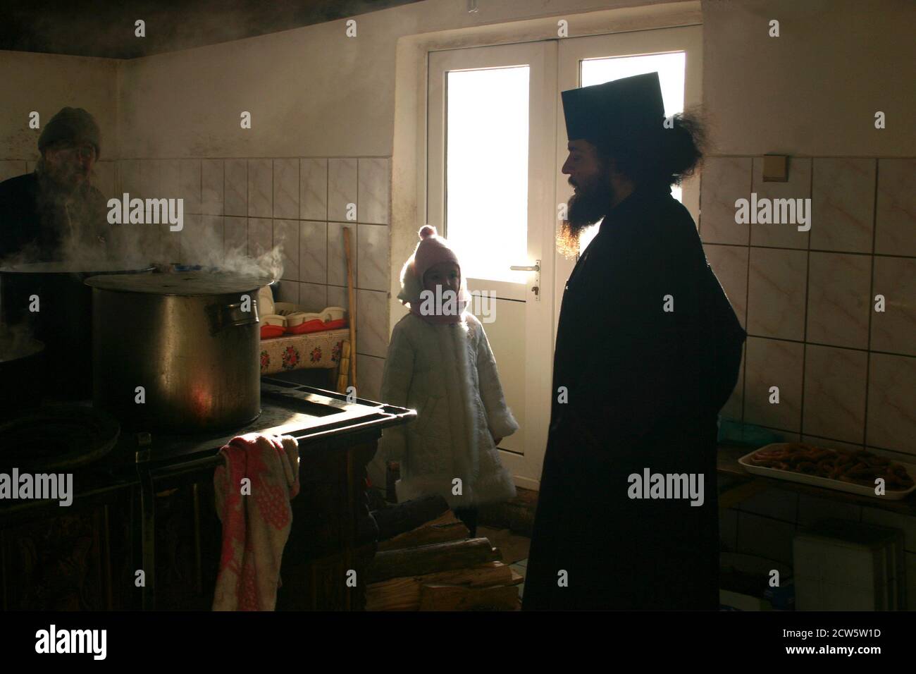Monks at a Christian Orthodox monastery in Romania preparing the meal ...