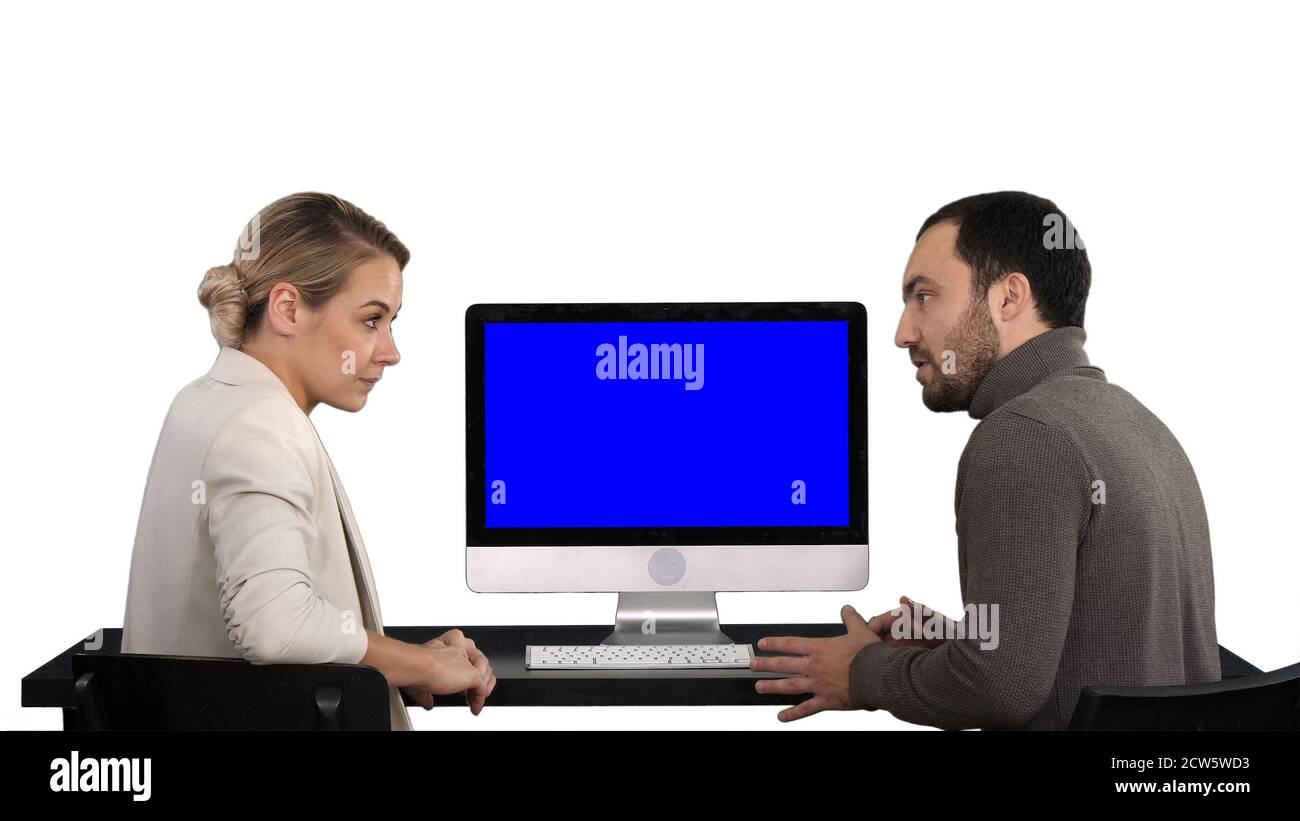 Business people having meeting around monitor of computer talkin Stock ...