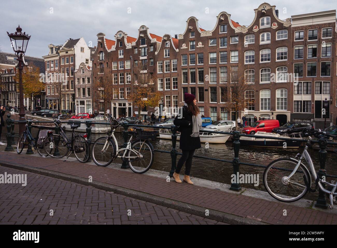A young woman in front of a canal in Amsterdam Stock Photo - Alamy