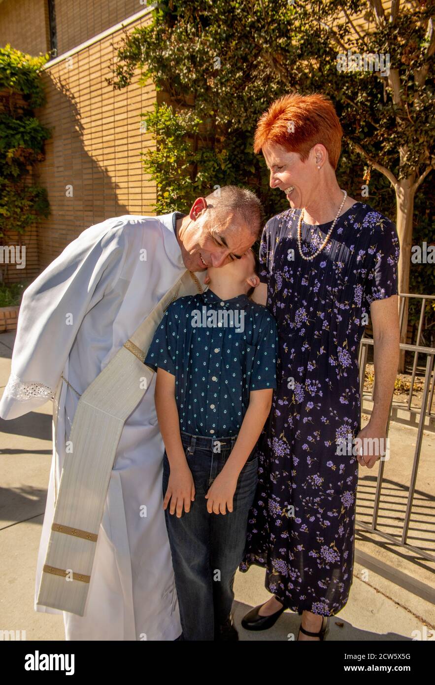 After mass, the deacon of a Southern California Catholic church poses ...