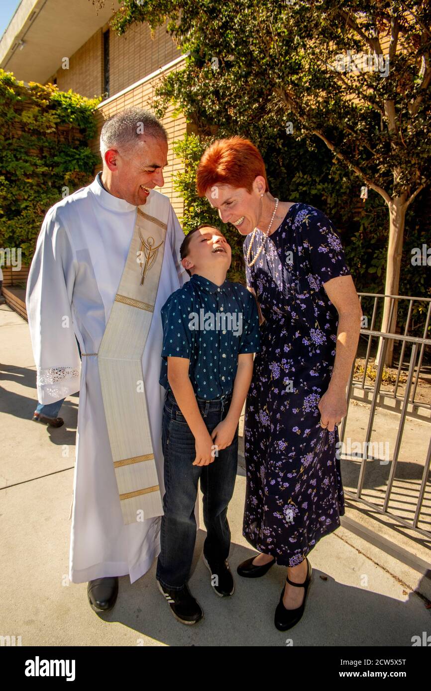 After mass, the deacon of a Southern California Catholic church poses ...