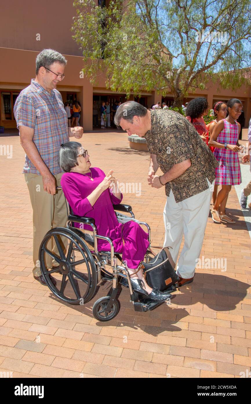 The deacon of a Southern California Catholic church greets a wheelchair ...