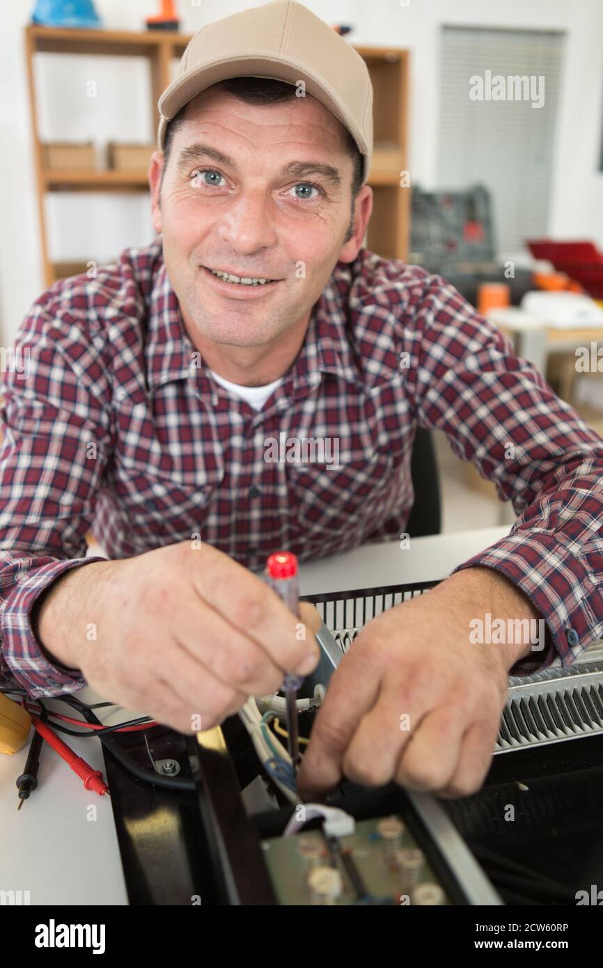 electrician testing appliance with electrical screwdriver Stock Photo ...