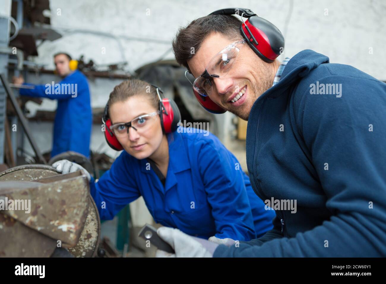 steel bar factory workers smiling Stock Photo - Alamy