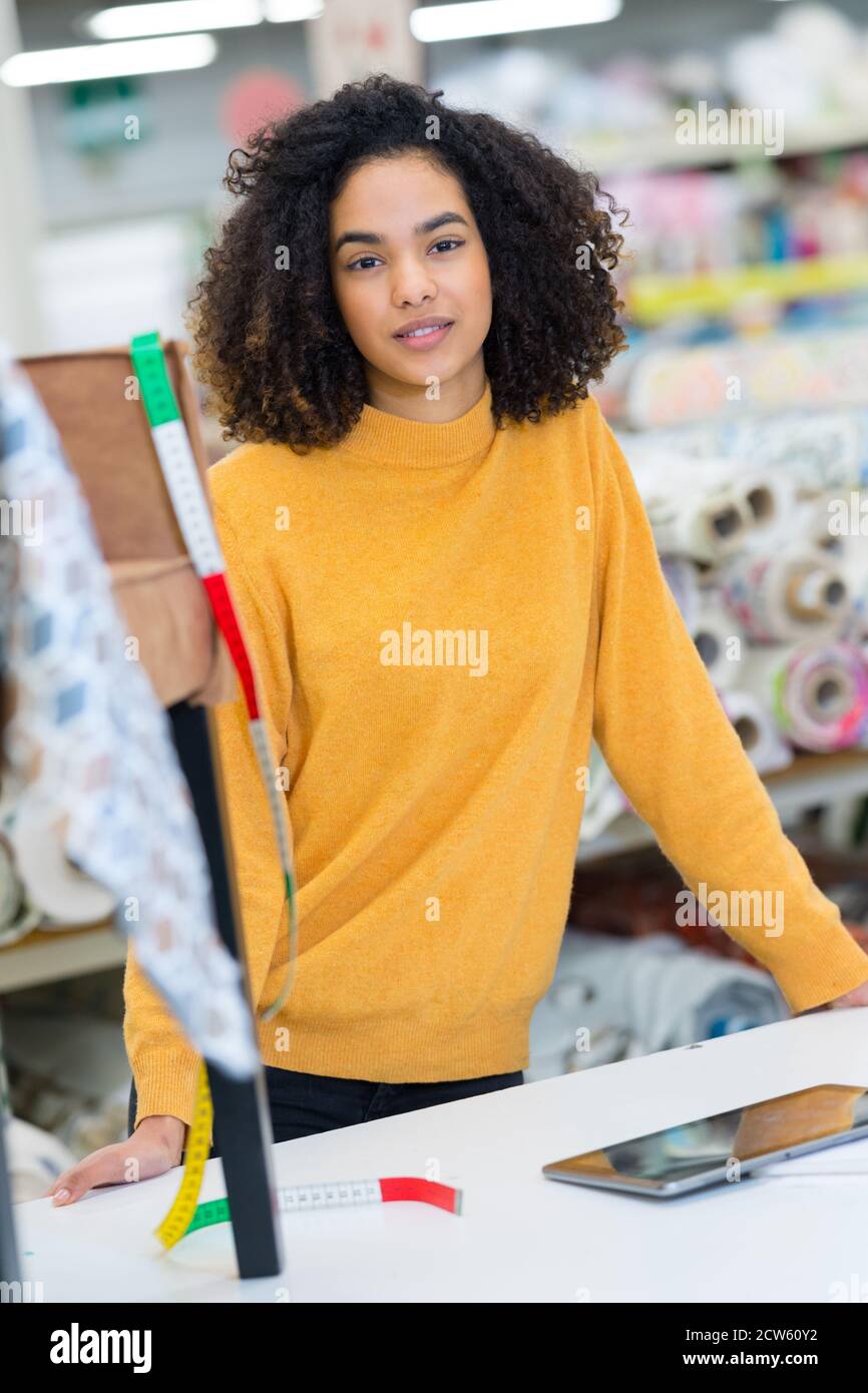 portrait of a young fabric vendor Stock Photo - Alamy