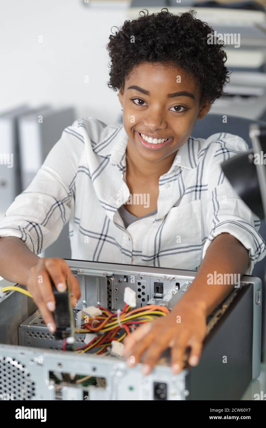 Woman repairing computer part hi-res stock photography and images - Alamy
