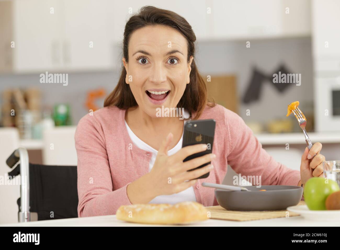 surprised woman on the wheelchair with euphoric expression Stock Photo ...