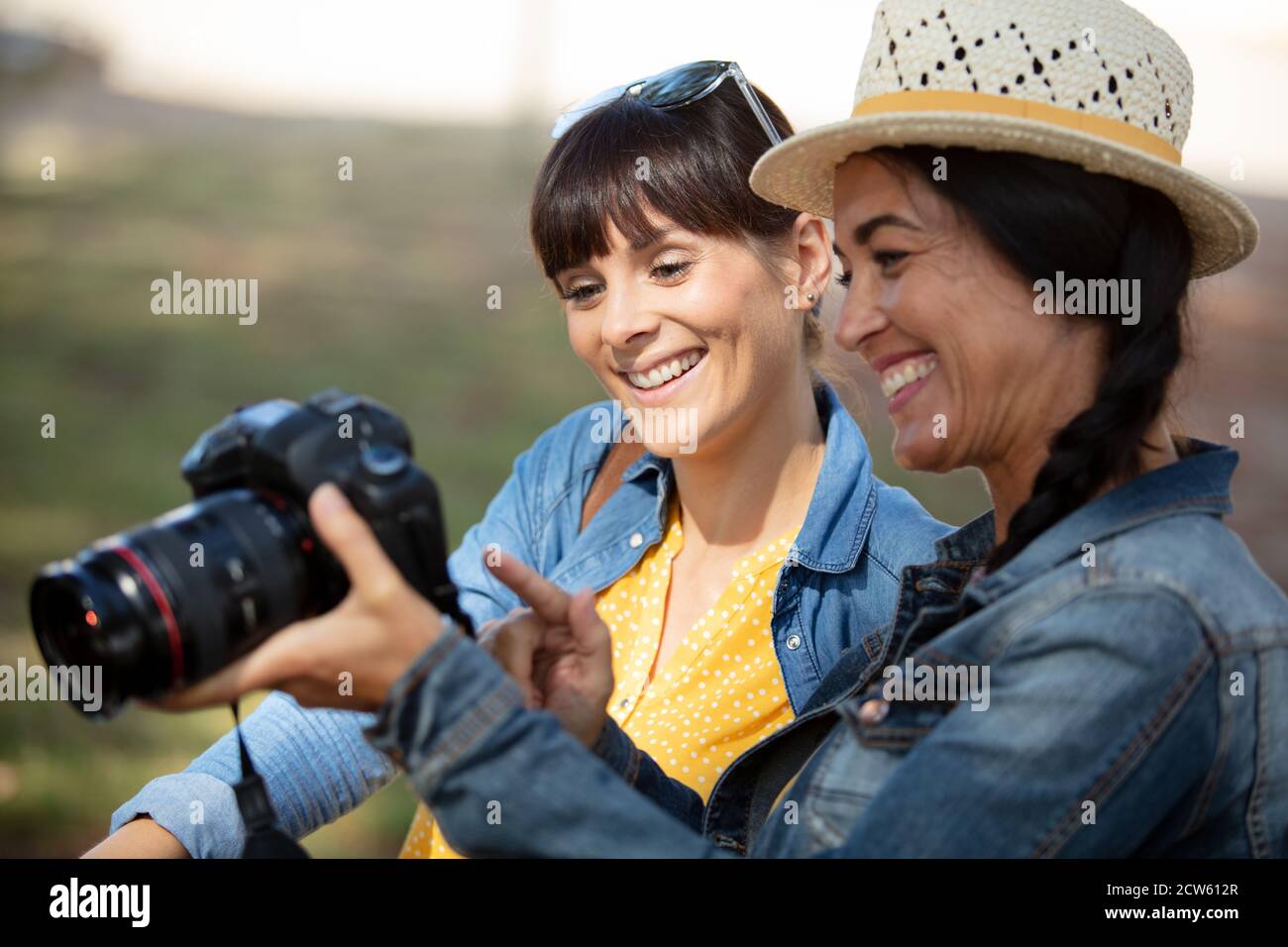 two girls friends looking at the camera Stock Photo - Alamy