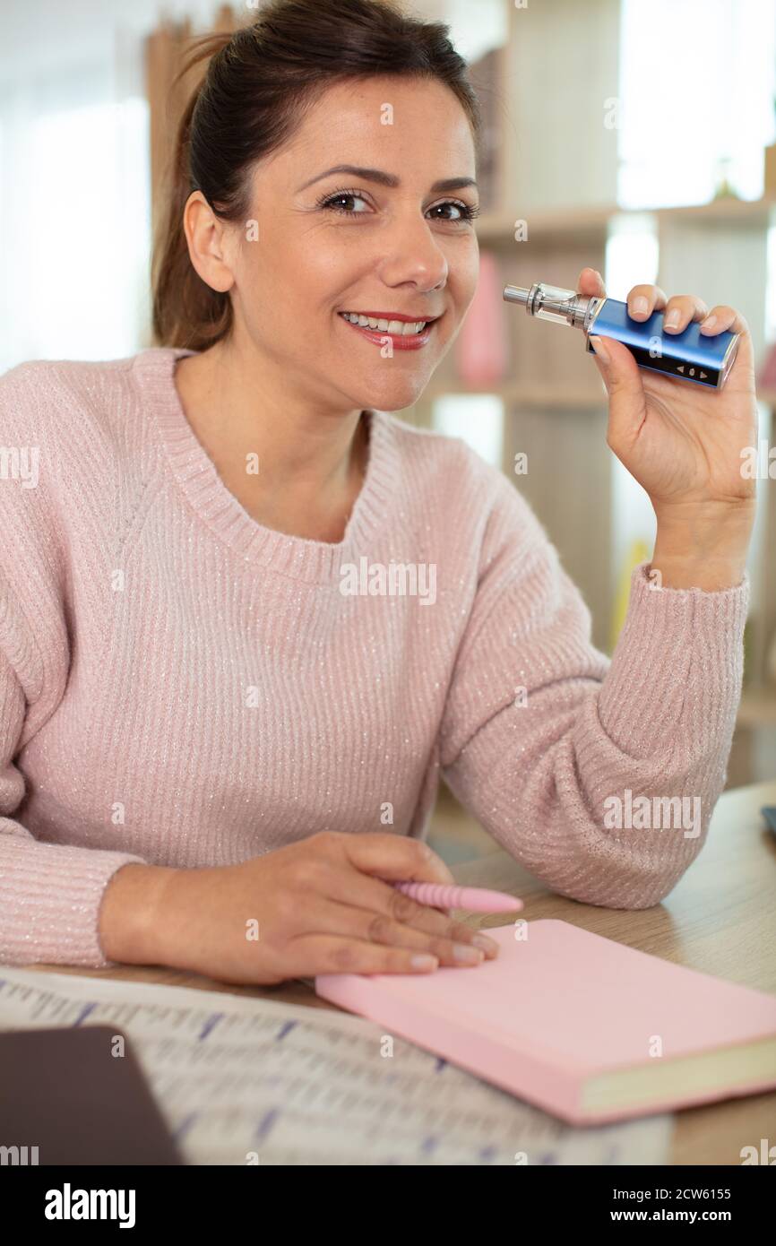 casual pretty woman vaping at home Stock Photo - Alamy