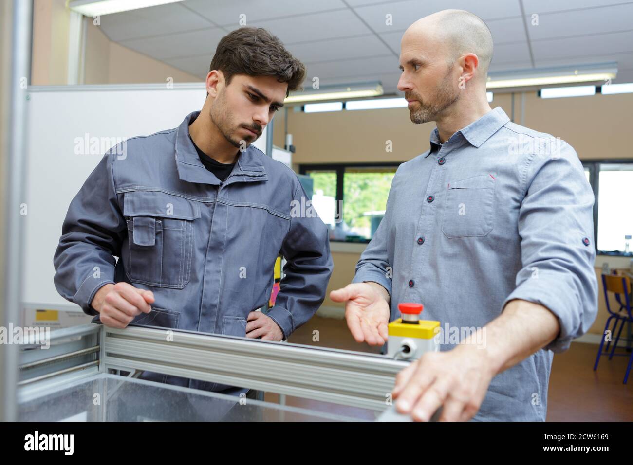two men during precision work Stock Photo - Alamy